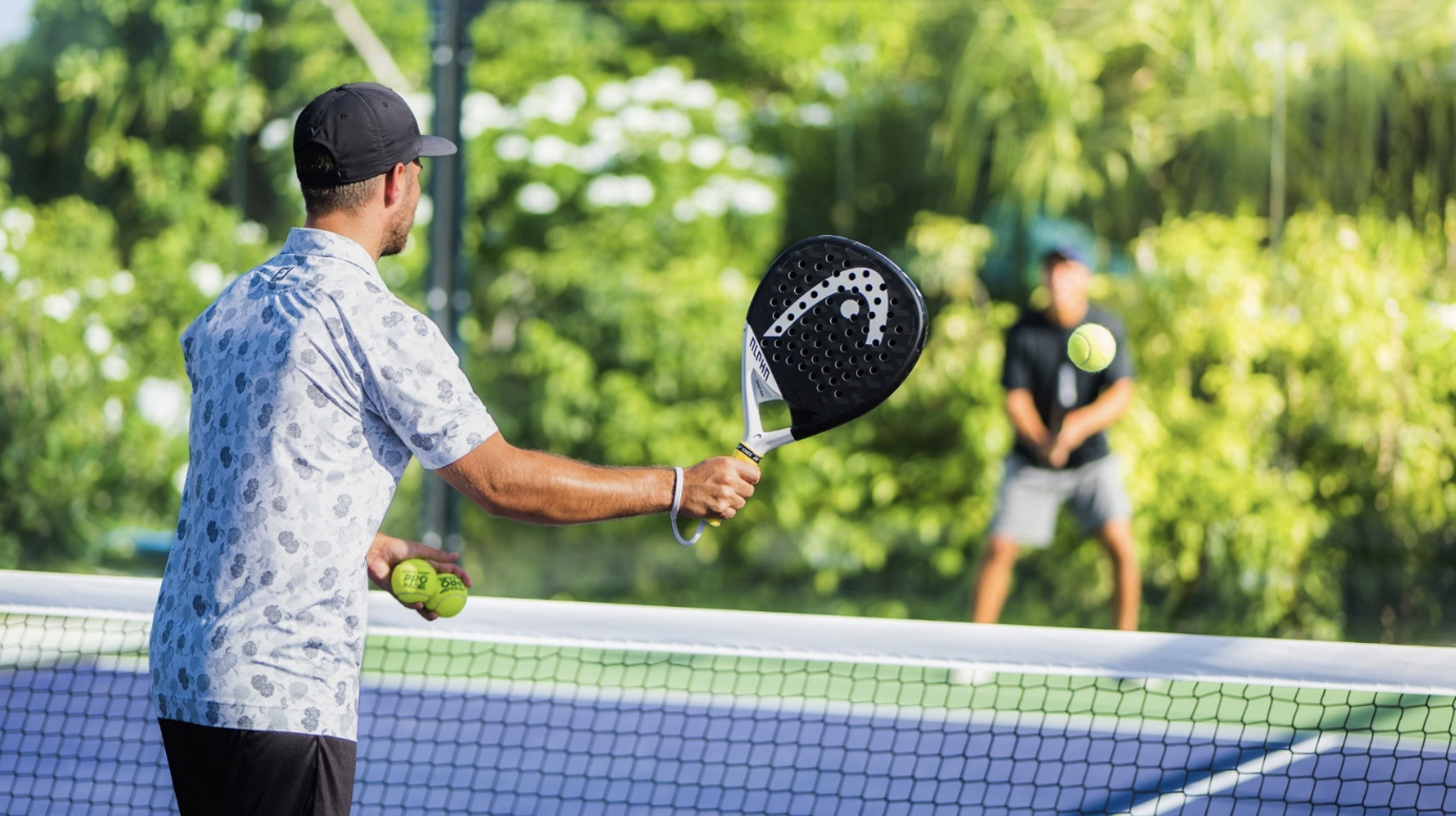 Padels up for a game of Padel Tennis at Hideaway Beach Resort & Spa